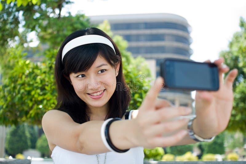 Woman taking self portrait stock photo. Image of happy - 9268170
