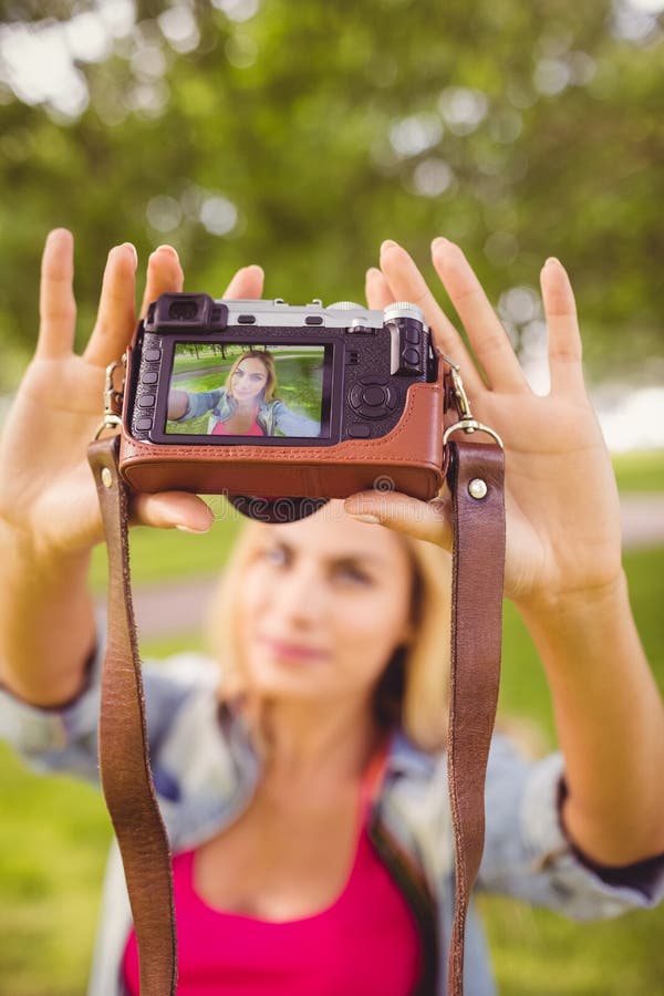 Woman Taking Self Portrait with Camera Stock Photo - Image of holding ...