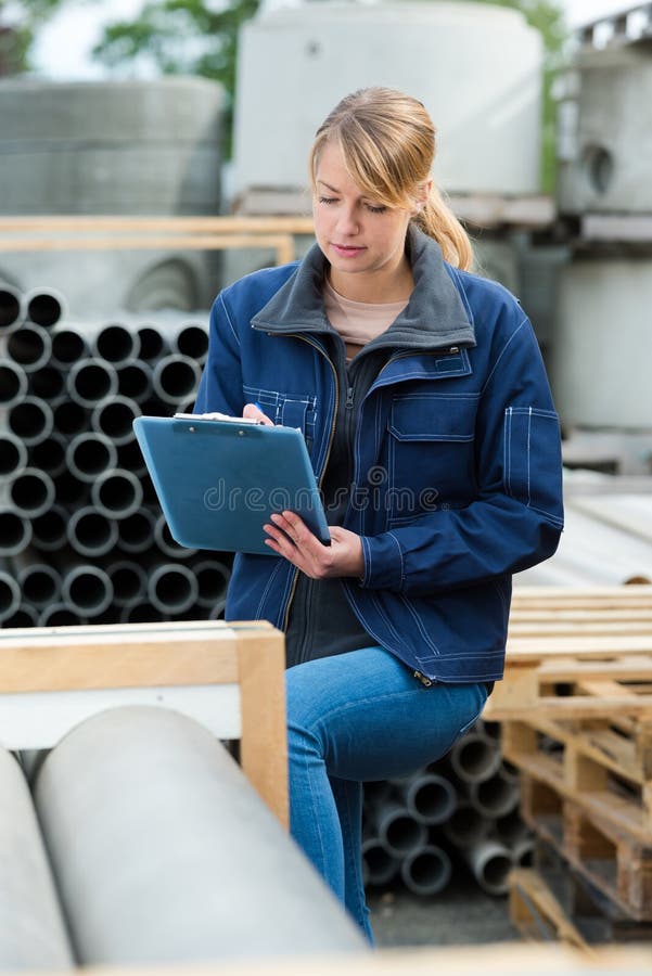 Woman Taking Stock in Warehouse Construction Company Stock Photo ...