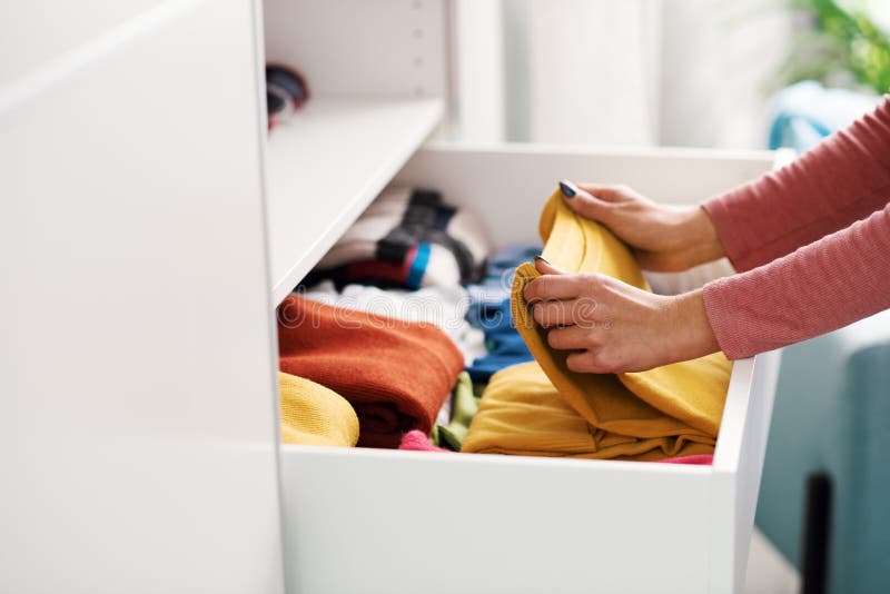 Woman Taking a T-shirt in a Drawer Stock Image - Image of folding ...