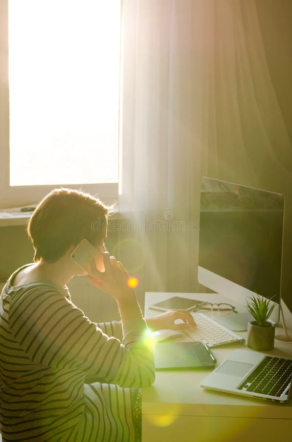 Woman Talking To Smartphone and Watching on Different Devices Stock ...