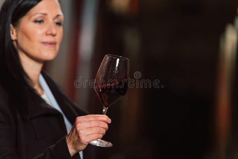 Woman Tasting Wine at the Wine Cellar Stock Photo - Image of storage ...