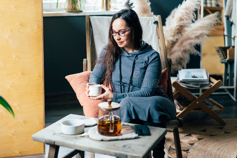 Woman tea cozy interior stock photo. Image of business - 176990234
