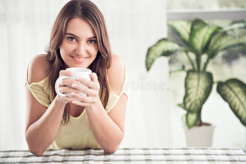 Woman with tea stock photo. Image of home, lovely, brunette - 39692306