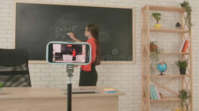 Woman Teacher in Classroom Streaming Live Video Lesson Conference ...