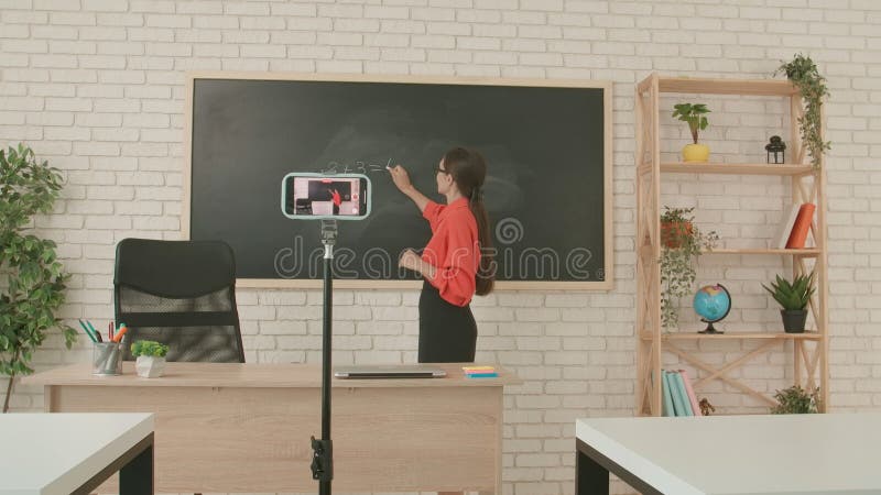Woman Teacher in Classroom Streaming Live Video Lesson Conference ...