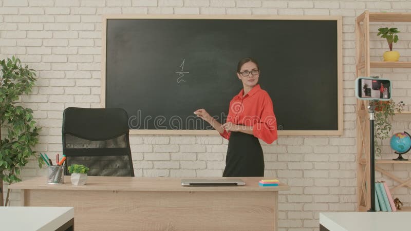 Woman Teacher in Classroom Streaming Live Video Lesson Conference ...