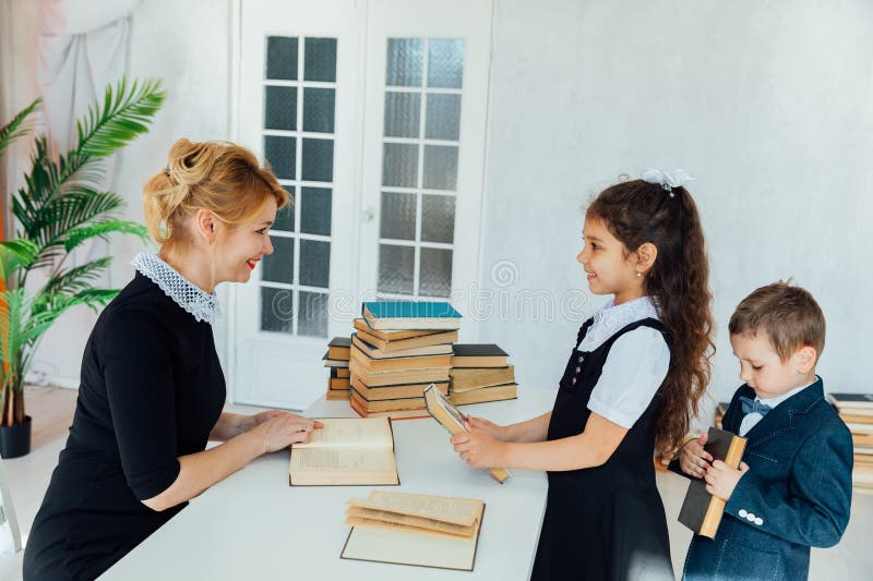 Woman Teacher Librarian in a Lesson at School with Children Stock Image ...