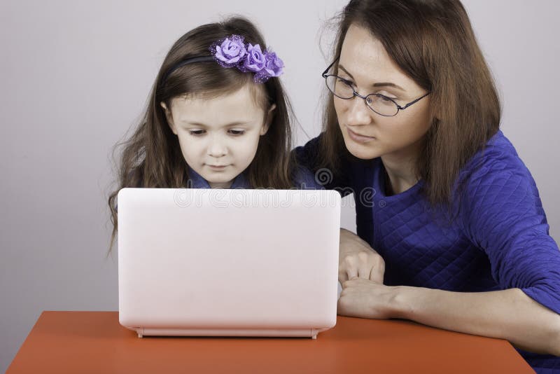 Woman Teaches a Child Work on the Computer Stock Photo - Image of ...