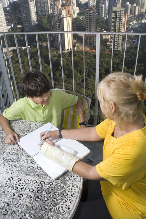 Woman Teaching Boy - Vertical Picture. Image: 5850250