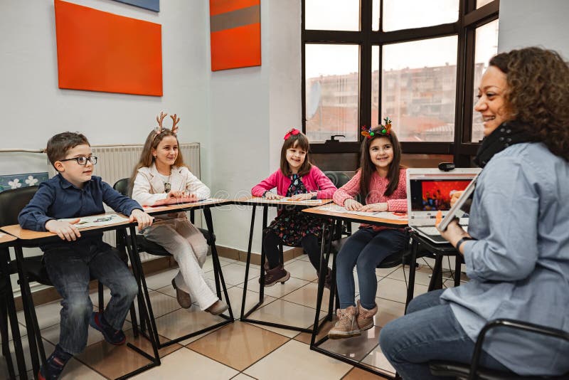 Woman Teaching a Group of Elementary Students at Language School Stock Image - Image of ...