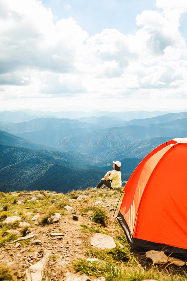Woman with a Tent on Top of a Mountain Stock Photo - Image of ...