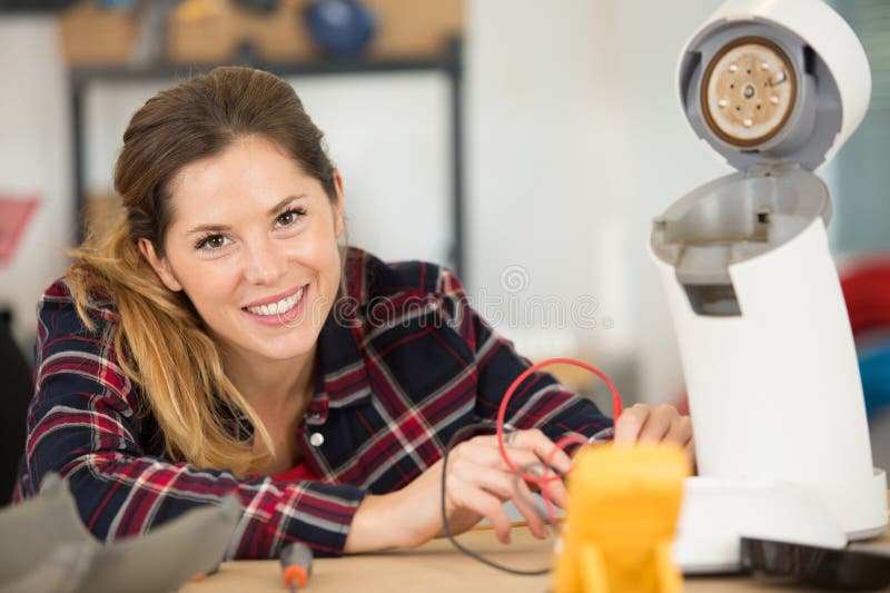 Woman Testing Appliance with Multimeter Stock Photo - Image of ...