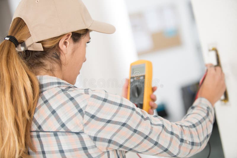Woman Testing Light Switch with Multimeter Stock Photo - Image of tool ...