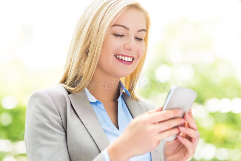 Woman text messaging stock photo. Image of holding, overcoat - 49517374