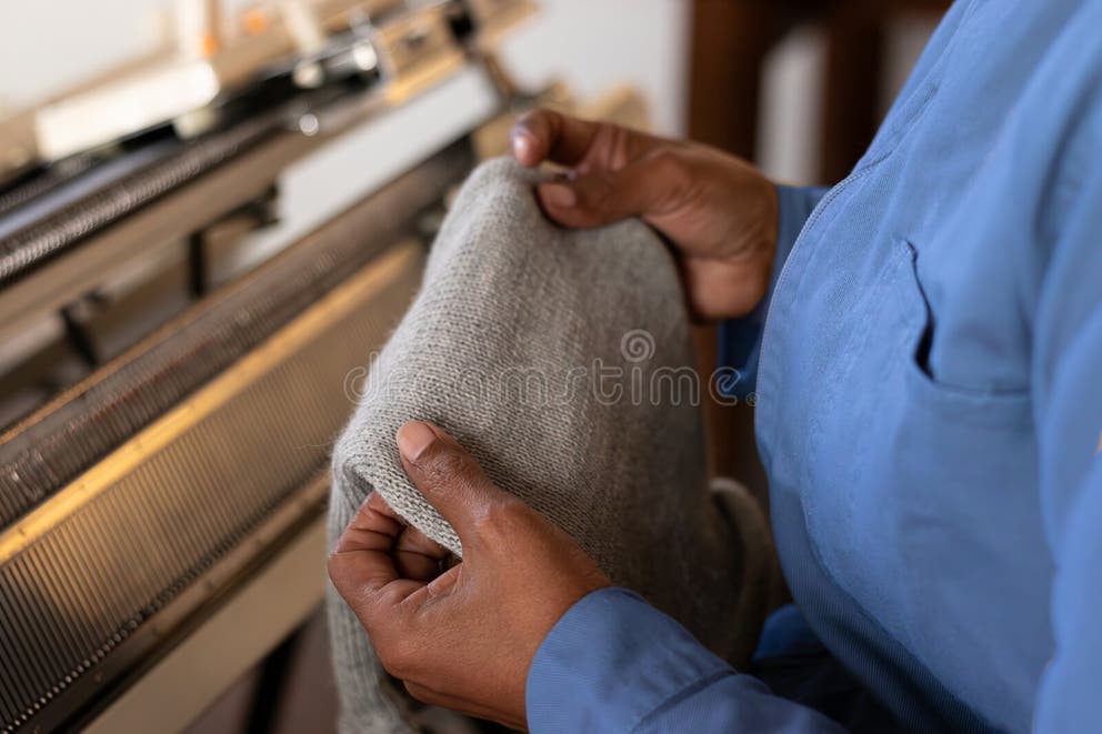 Woman Textile Worker Using Weaving Machine with Patterns on a Piece of ...