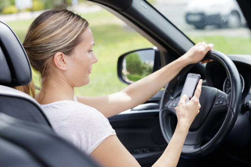Woman Texting while Driving Stock Image - Image of unlawful, traffic ...