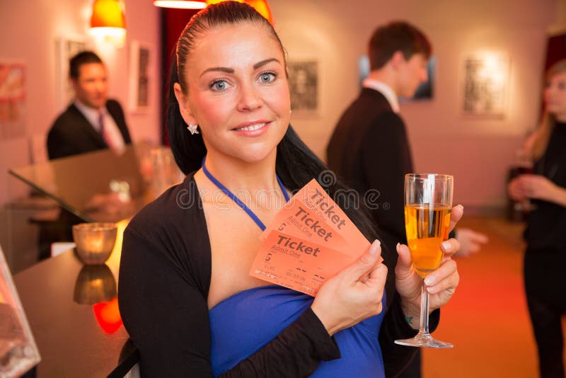 Woman in Theatre Presenting Tickets Stock Photo - Image of glas ...