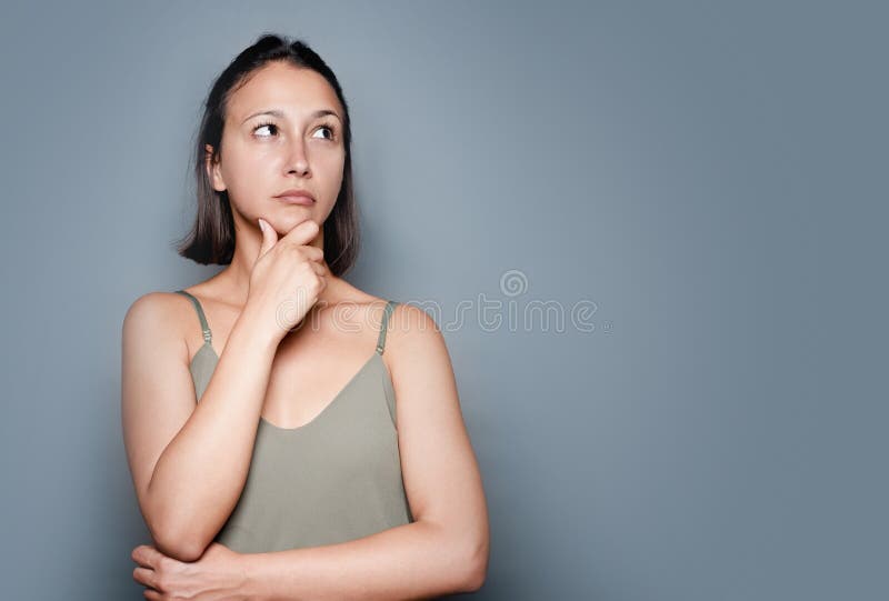 Thoughtful Young Woman Portrait Isolated on Background Stock Photo ...