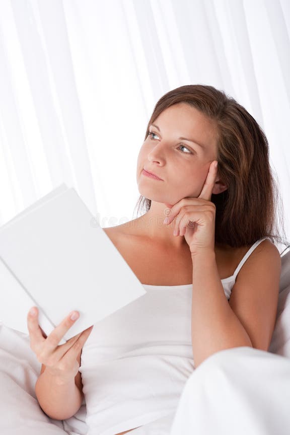 Woman Thinking while Reading Book Stock Image - Image of sofa ...