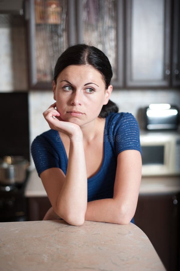 Woman thinking of a recipe stock image. Image of hair - 31649613