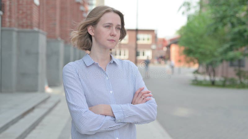 Woman Thinking while Standing Outside Stock Image - Image of serious ...