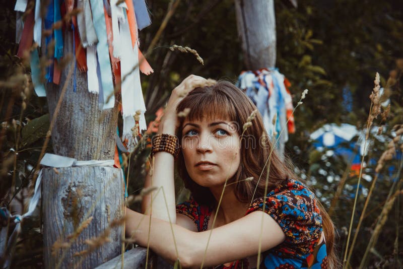 Woman thinking of a tree stock photo. Image of pondering - 98676940