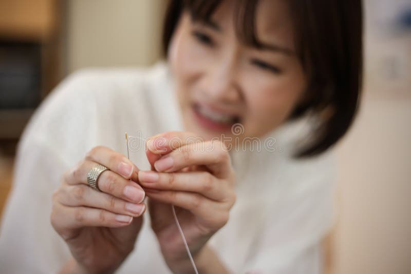 109 Old Woman Threading Needle Stock Photos - Free & Royalty-Free Stock ...