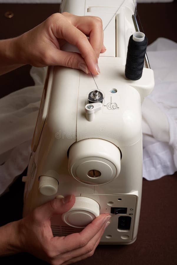 Woman Threading on Sewing Machine Stock Photo - Image of needle ...