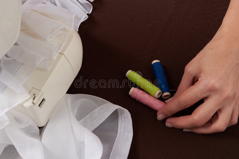 Woman Threading on Sewing Machine Stock Photo - Image of metal, detail ...