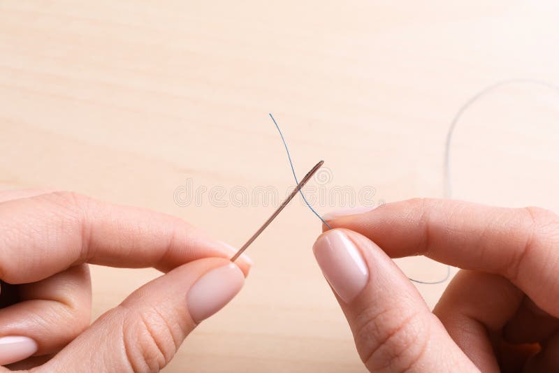 Woman Threading Sewing Needle at Table, Closeup Stock Image - Image of ...