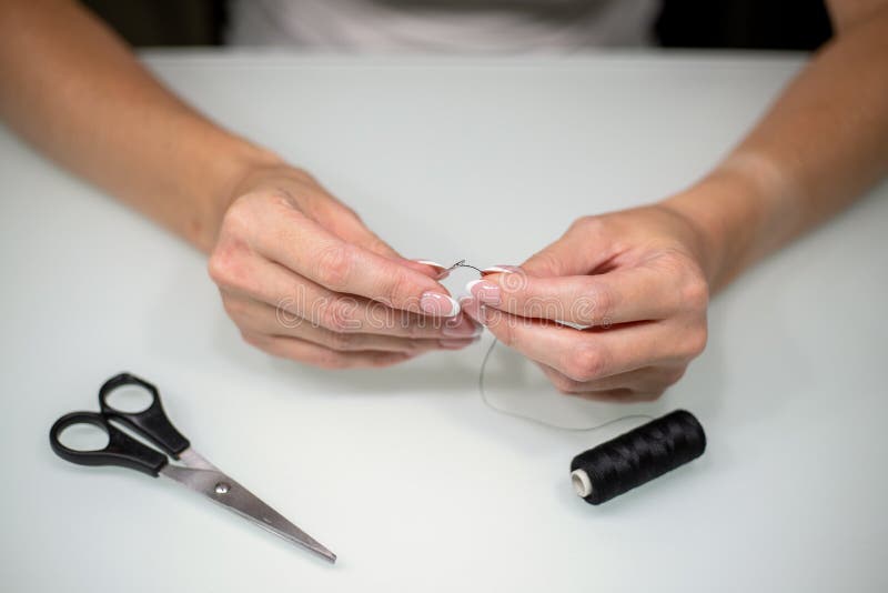 Woman Threading Sewing Needle at Table, Closeup Stock Image - Image of ...