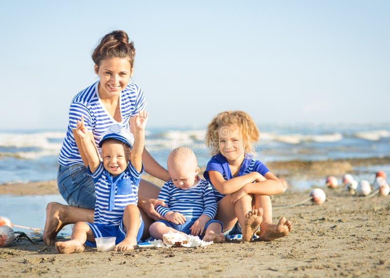 Woman with three children stock photo. Image of children - 76355032