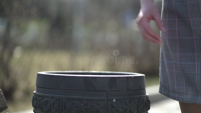 Woman Throwing Burger into Trash Bin on the Street Stock Video - Video ...