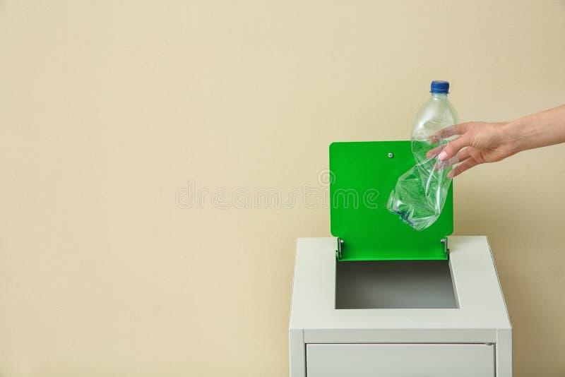 Woman Throwing Empty Plastic Bottle into Trash Bin on Color Background ...