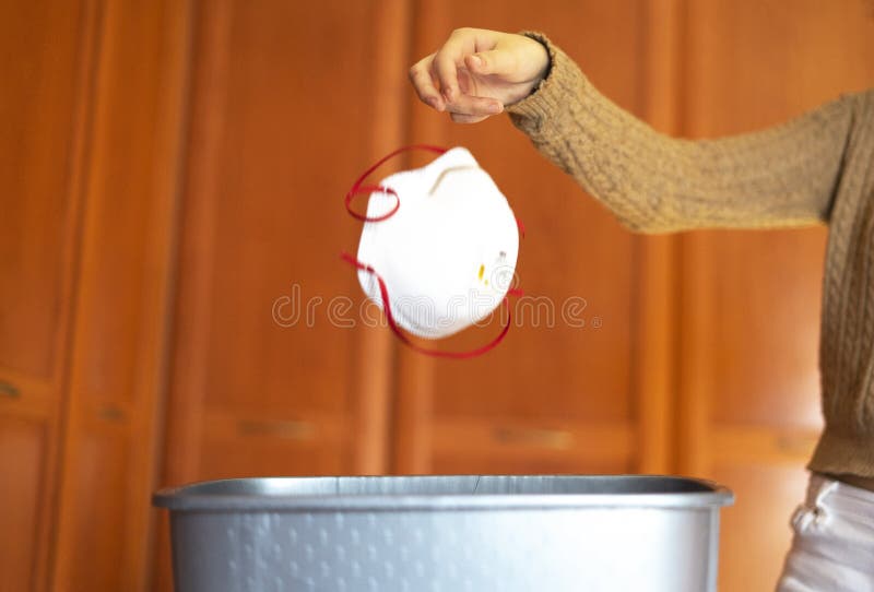 Woman Throwing the Mask in the Trash. Stock Photo - Image of refused ...