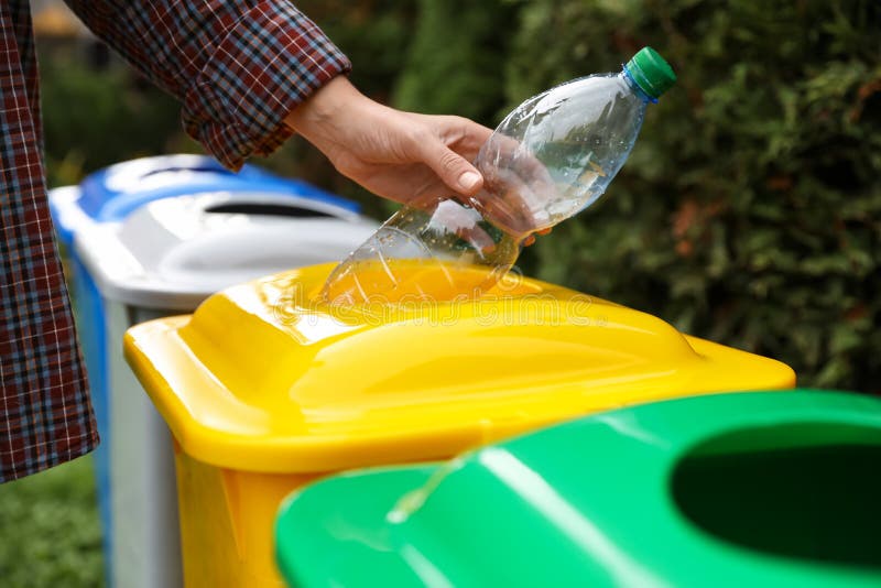 Woman Throwing Plastic Bottle into Recycling Bin Outdoors, Closeup ...