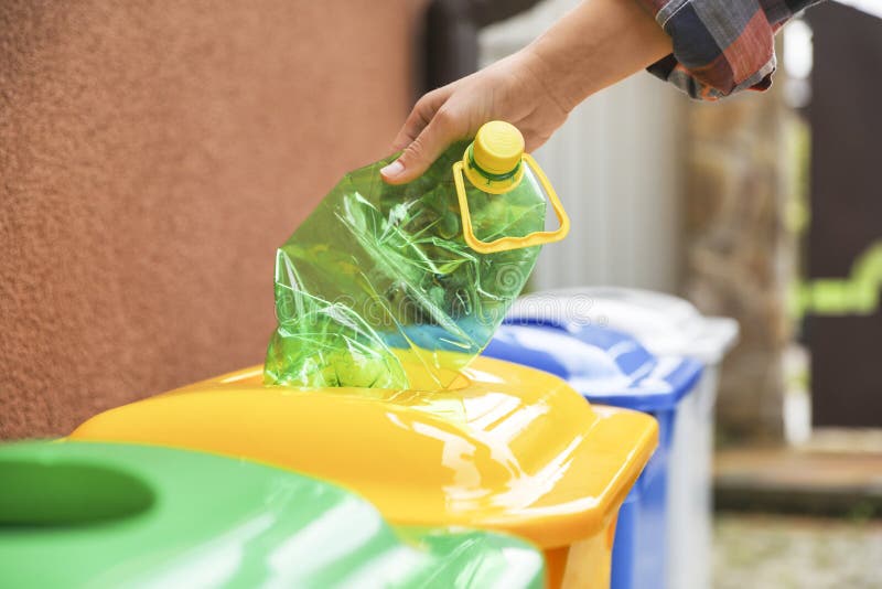 Woman Throwing Plastic Bottle into Recycling Bin Outdoors, Closeup ...