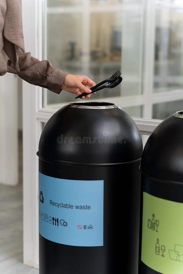Woman Throwing Plastic Fork and Spoon To the Proper Container for ...