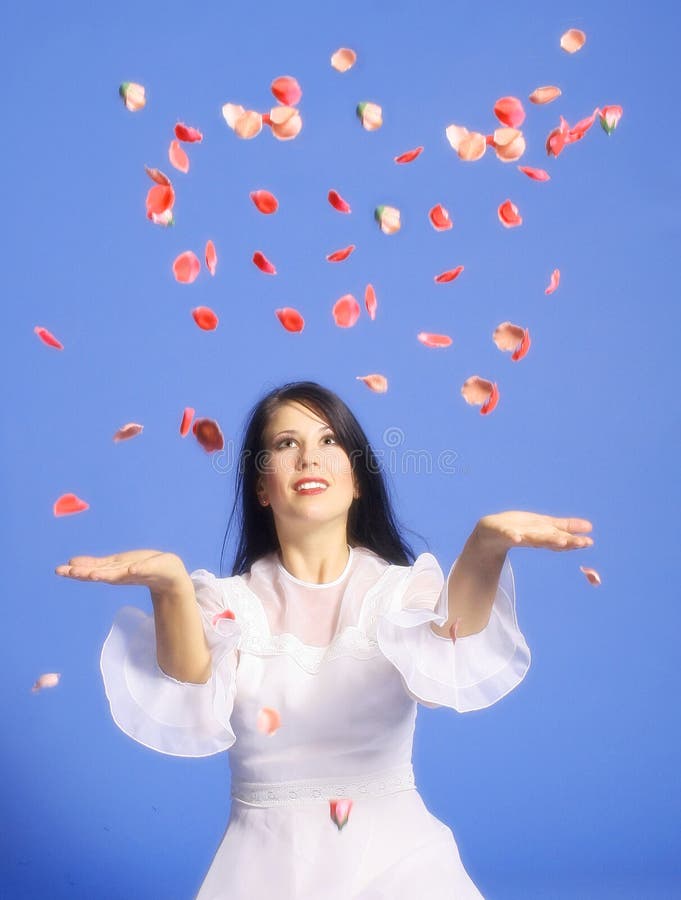 Woman throwing rose petals stock image. Image of fashion - 1830607