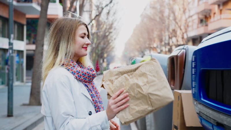 Woman Throwing Trash into Household Bins for Waste Sorting in the ...