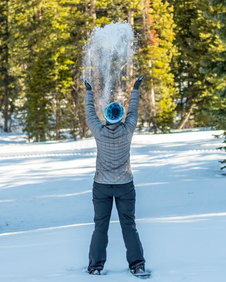 Woman Throws Snow in the Air Stock Photo - Image of green, outdoor ...