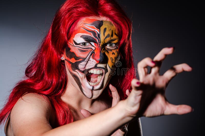 Woman with Tiger Face in Halloween Stock Photo - Image of fashion, face ...