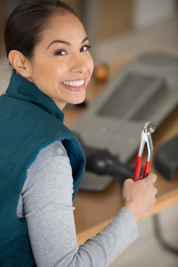Woman with Tools Smiling at Camera Stock Photo - Image of plaster ...