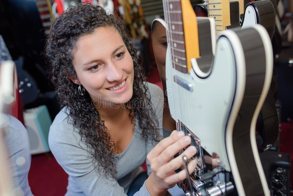 Woman touching guitar stock photo. Image of smile, touching - 261516450