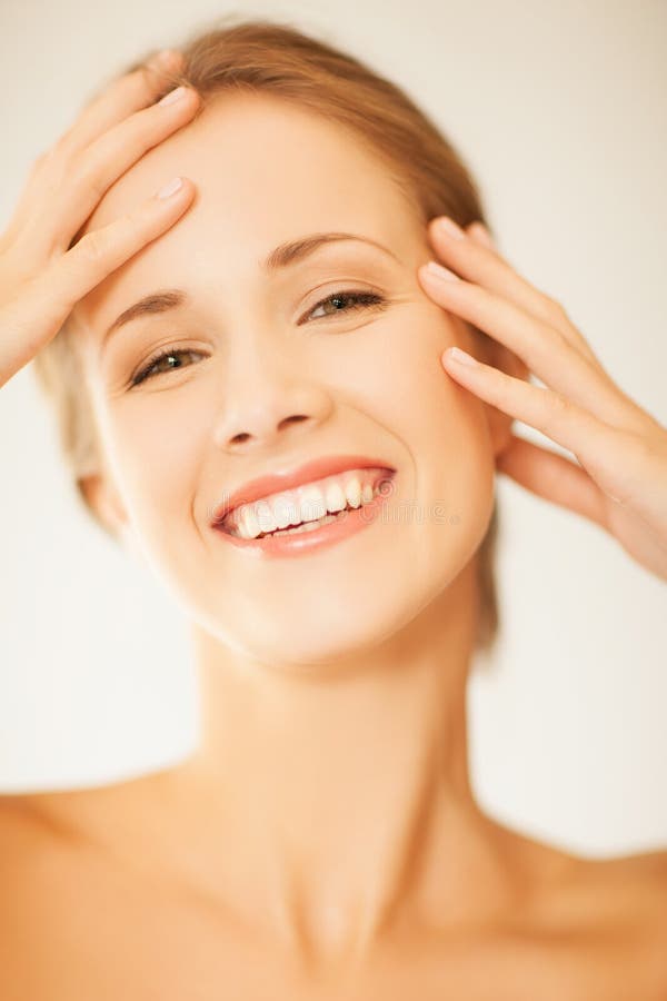 Woman touching her face stock photo. Image of pretty - 38223354