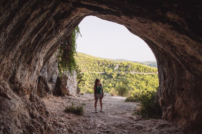 Woman Tourist Exploring a Cave Stock Photo - Image of outdoor, frozen ...