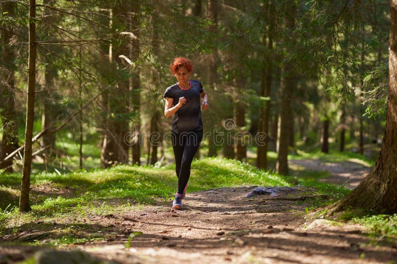 Woman Trail Runner in the Forest Stock Photo - Image of running ...