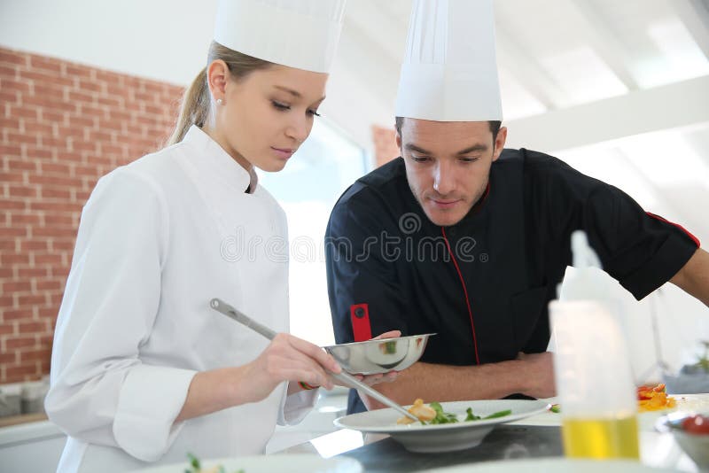 Woman Trainee in Cooking Class with Chef Stock Image - Image of recipe ...