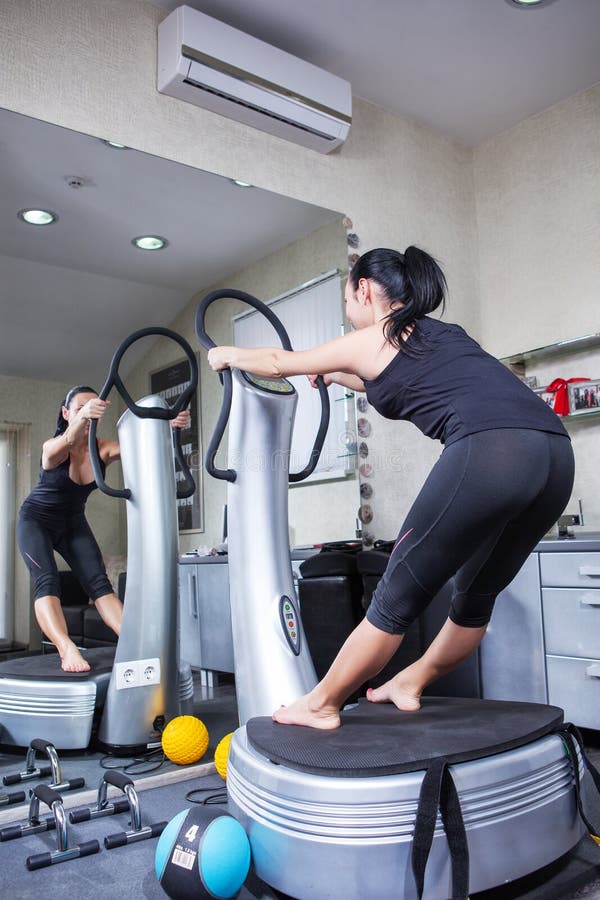 Woman on Trainer Machine in Sport Gym Stock Photo - Image of female ...